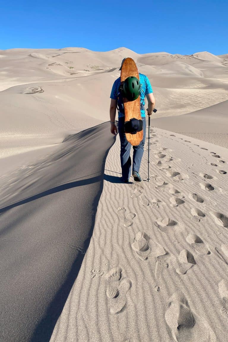 Sandboarding in Colorado (Great Sand Dunes) - Champagne Tastes®